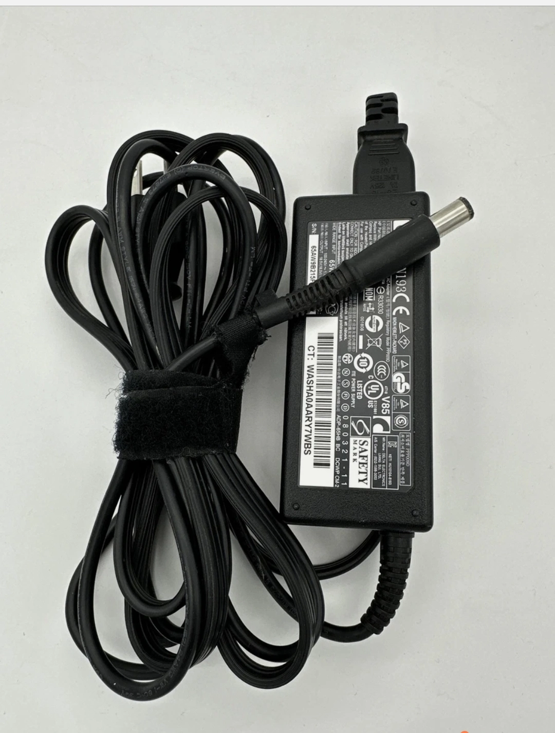 HP 65W laptop AC power adapter with a large/big pin connector, also ...