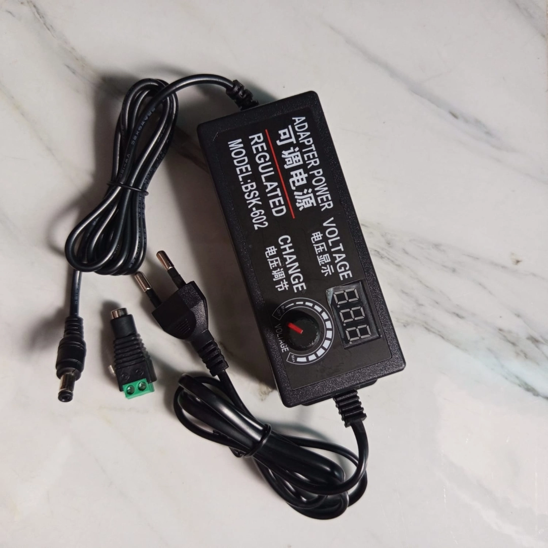 Adjustable Power Adapter converts AC input (100-240V) to adjustable DC ...